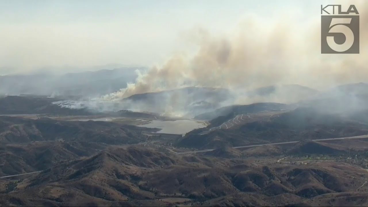 Crews battle wind-driven Bond Fire in Orange County, California - YouTube