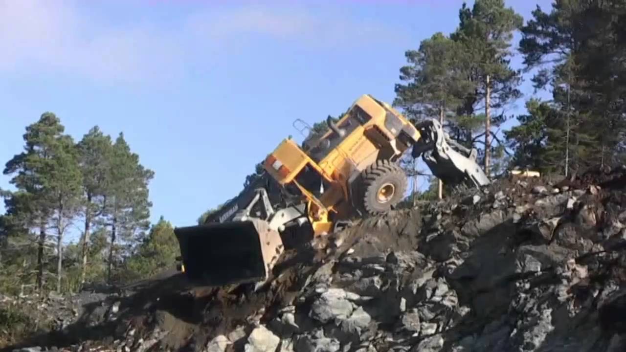 Frontloader tips over - driver falls 20 meters - YouTube