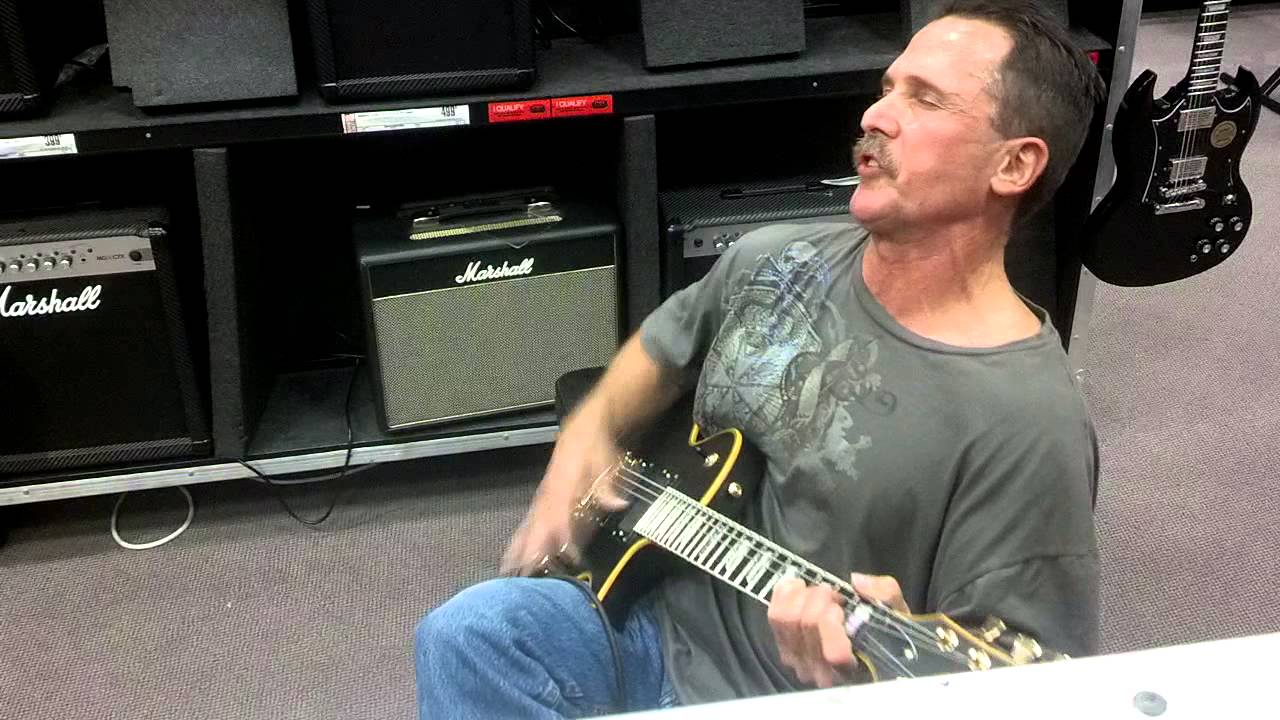 guy rocking out at a music store - YouTube