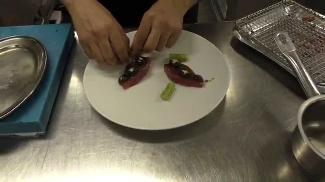 Francis Tavarez prepares a pigeon dish at the Michelin star restaurant ...