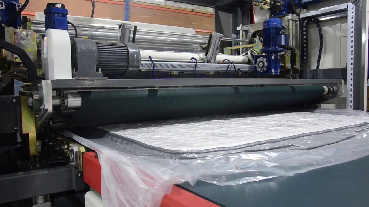 Automatic mattress compress&roll packing machine - YouTube