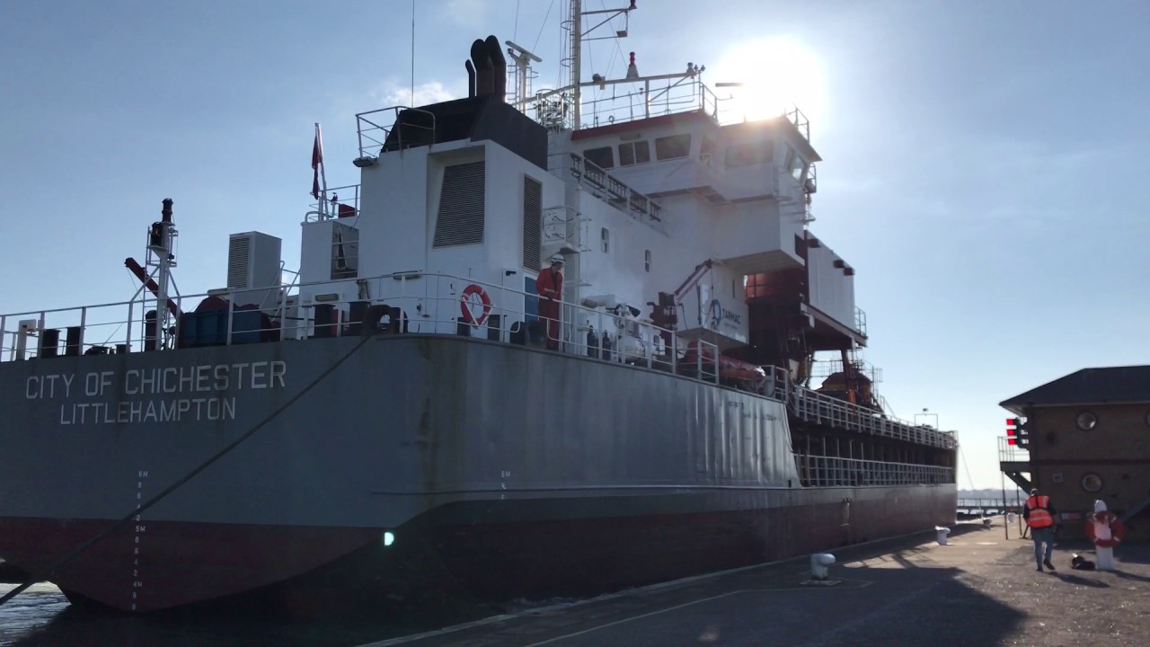 Large boat going through Shoreham harbour lock - YouTube