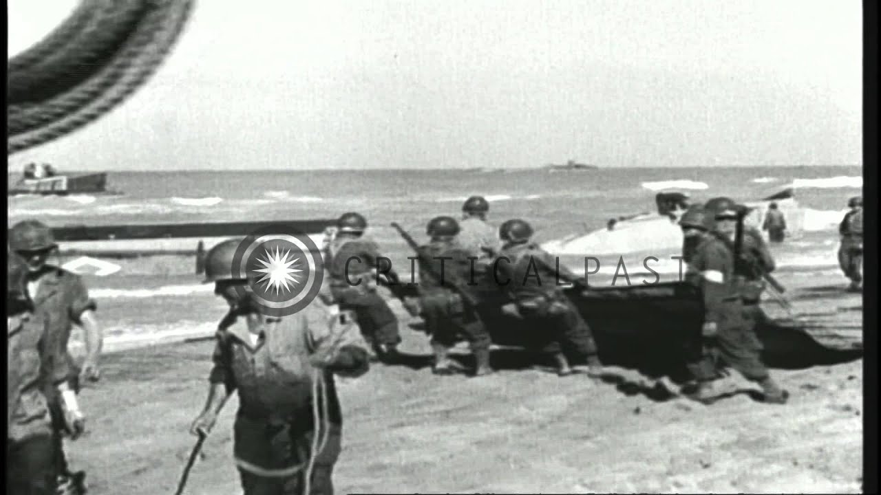 US Army Lieutenant General Patton comes onto a shore in a landing craft ...