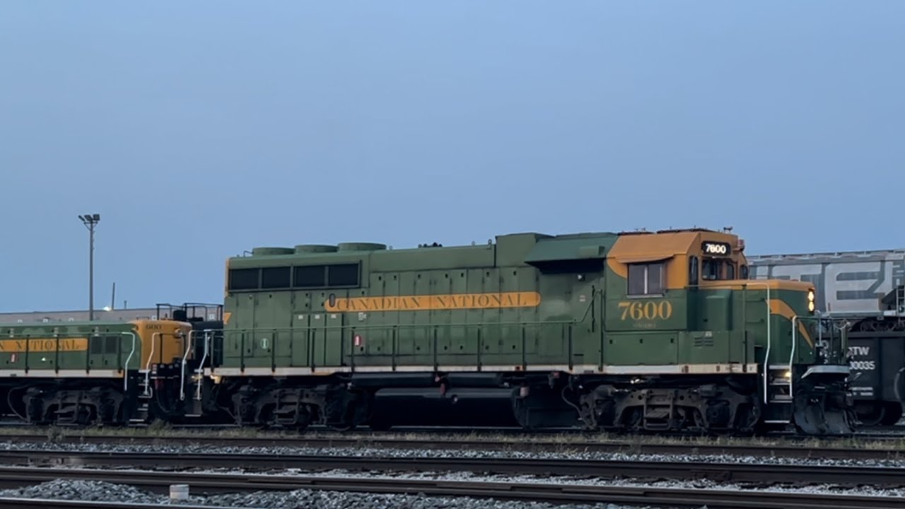 Canadian national manifest with 2 sd70aces leading and a green Cn slug ...