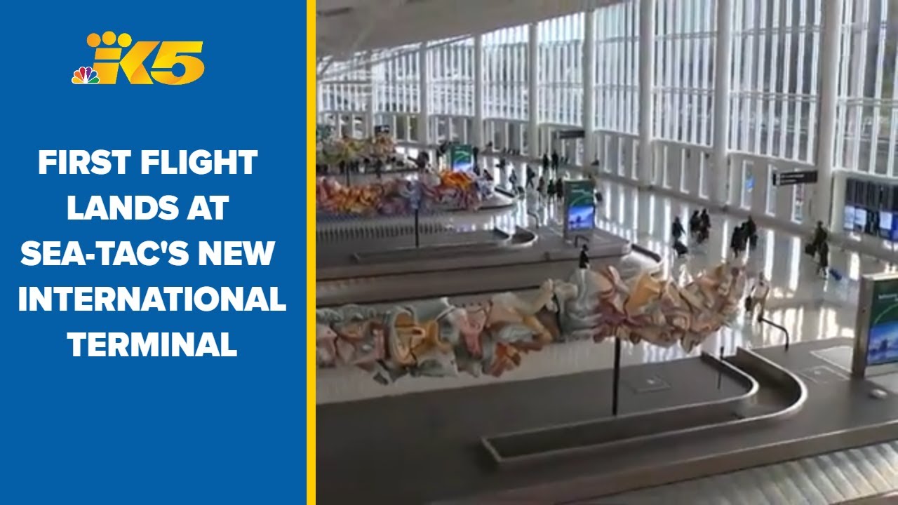 First flight lands at Sea-Tac's brand new international terminal - YouTube