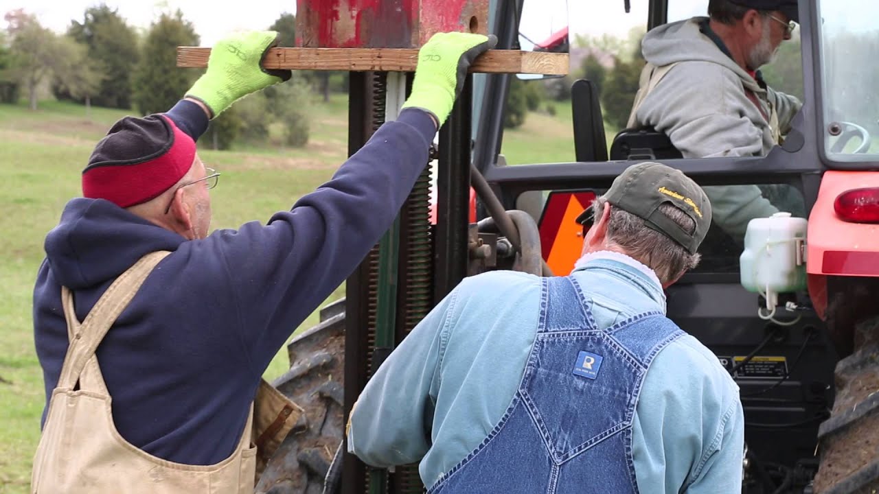 Pushing steel posts in the ground - YouTube