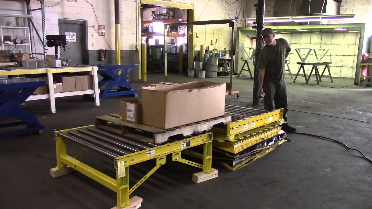 VERTI-LIFT EXTRA WIDE BASE LIFT WITH MANUAL TURN TABLE & CONVEYOR - YouTube