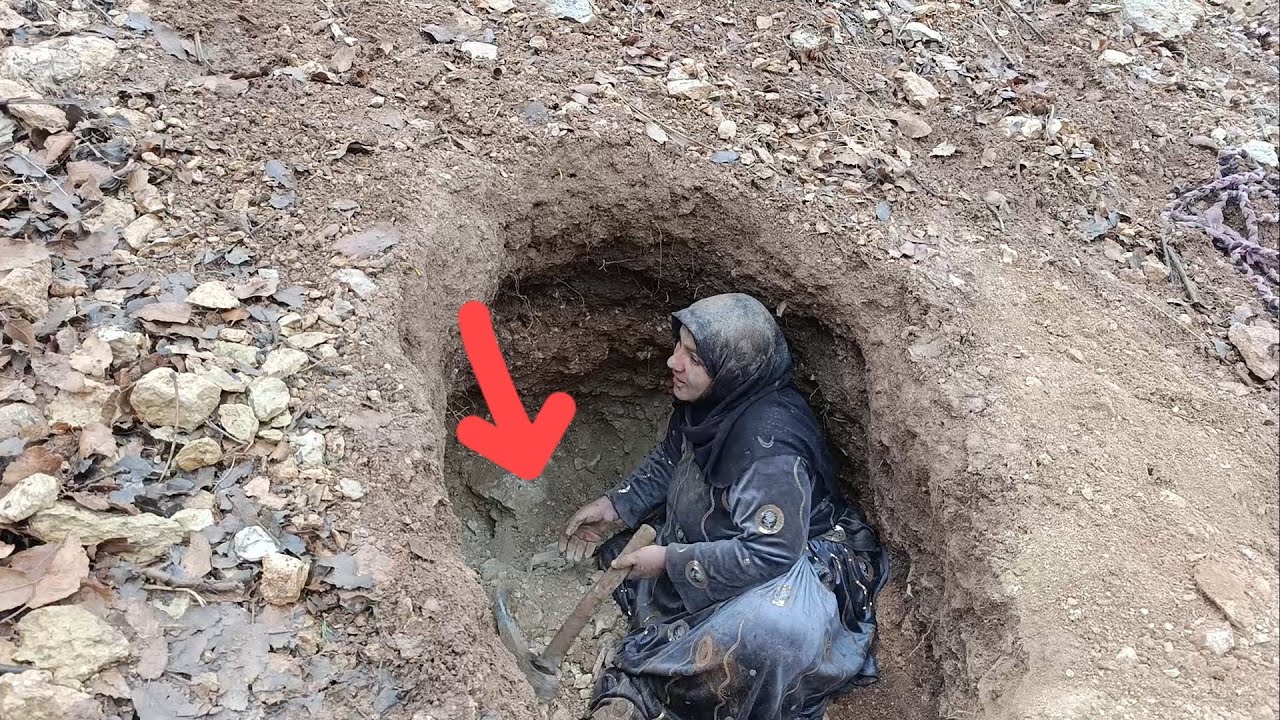 Nomadic caveman woman who is digging a cave on a heavy rainy day - YouTube