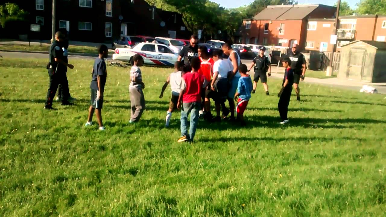 police officers playing soccer with kids - YouTube