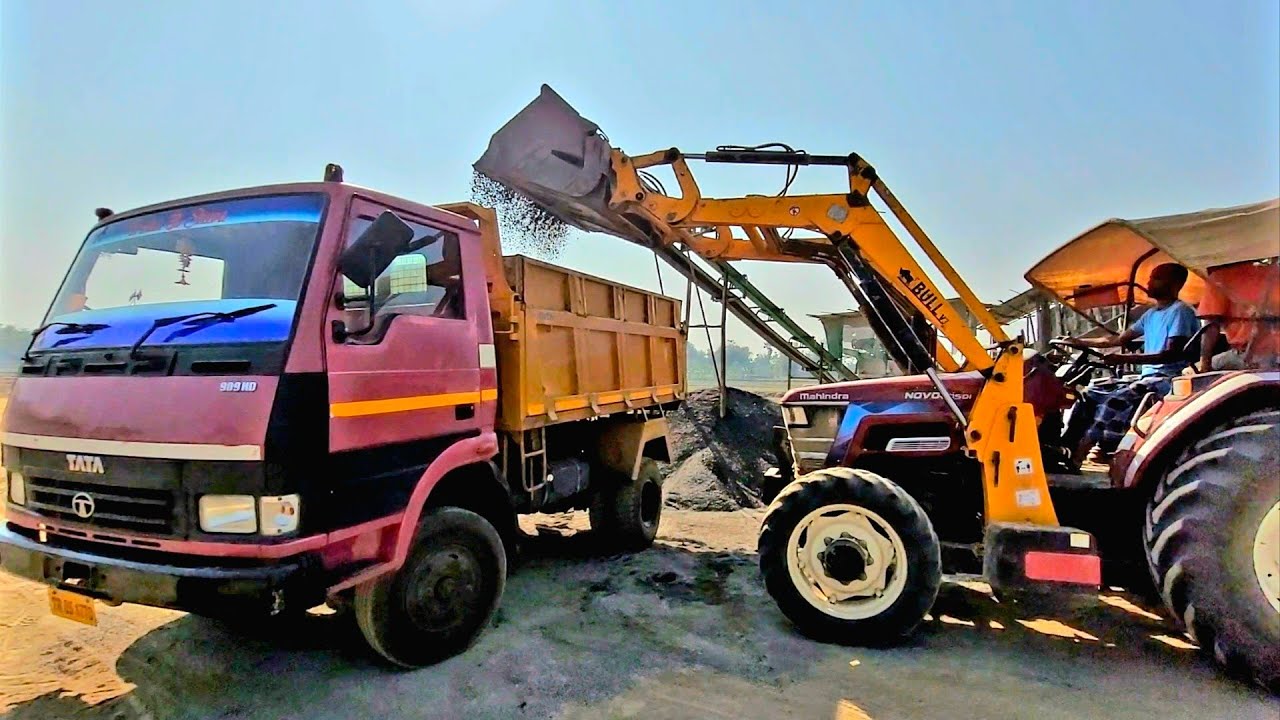 Tractor Loader Loading Stone in a Tata Tipper - YouTube