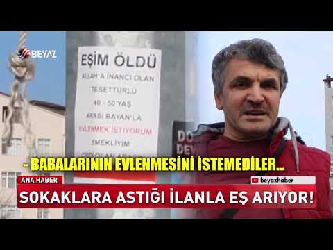 Sokaklara astığı ilanla eş arıyor