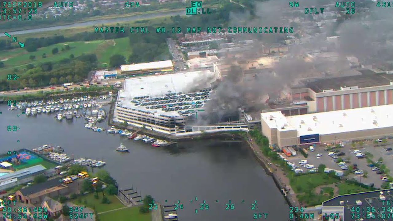 Hundreds of Firefighters Rush To Massive Parking Garage Fire - YouTube