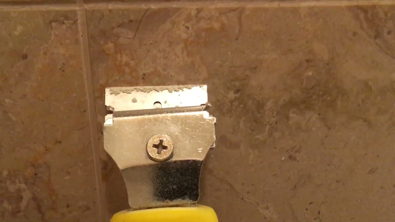 Removing invisible soap scum with a razor - YouTube