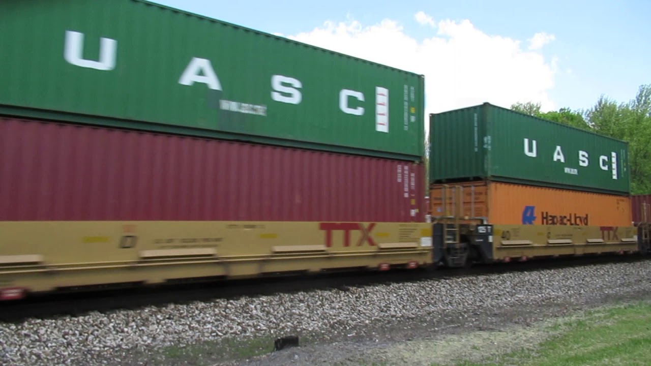 CN 3839. 2903 swiftly move Westbound intemodal container train in well ...