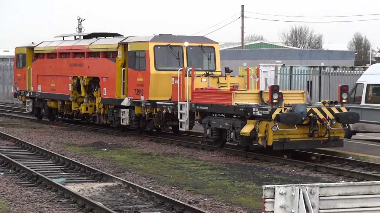 A bright sight! Colourful rail machine seen at Ely (HD) - YouTube