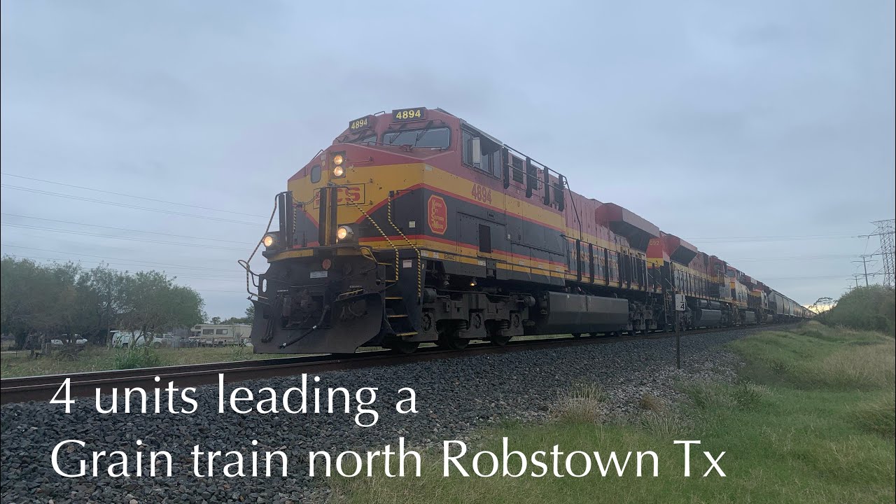 KCS ES44AC 4894 North leads a 4 unit consist on a grain train past ...