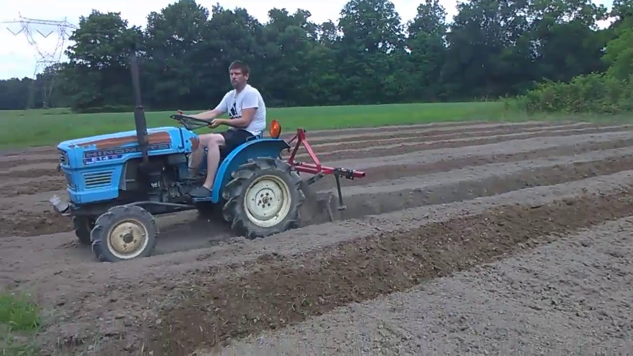 Building raised beds with row hillers - YouTube