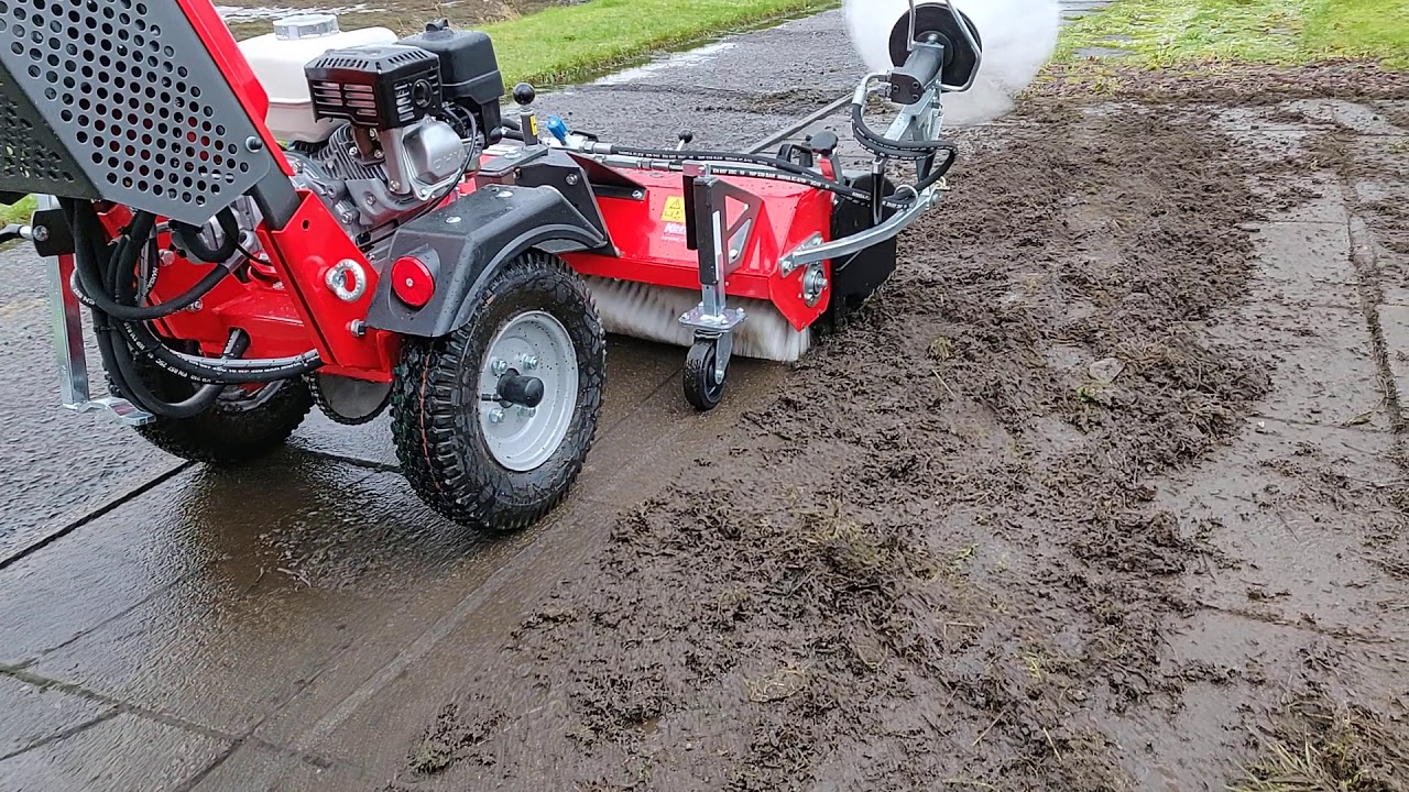 Kersten UK K1500 with sweeper attachment removing soil, moss and weeds ...