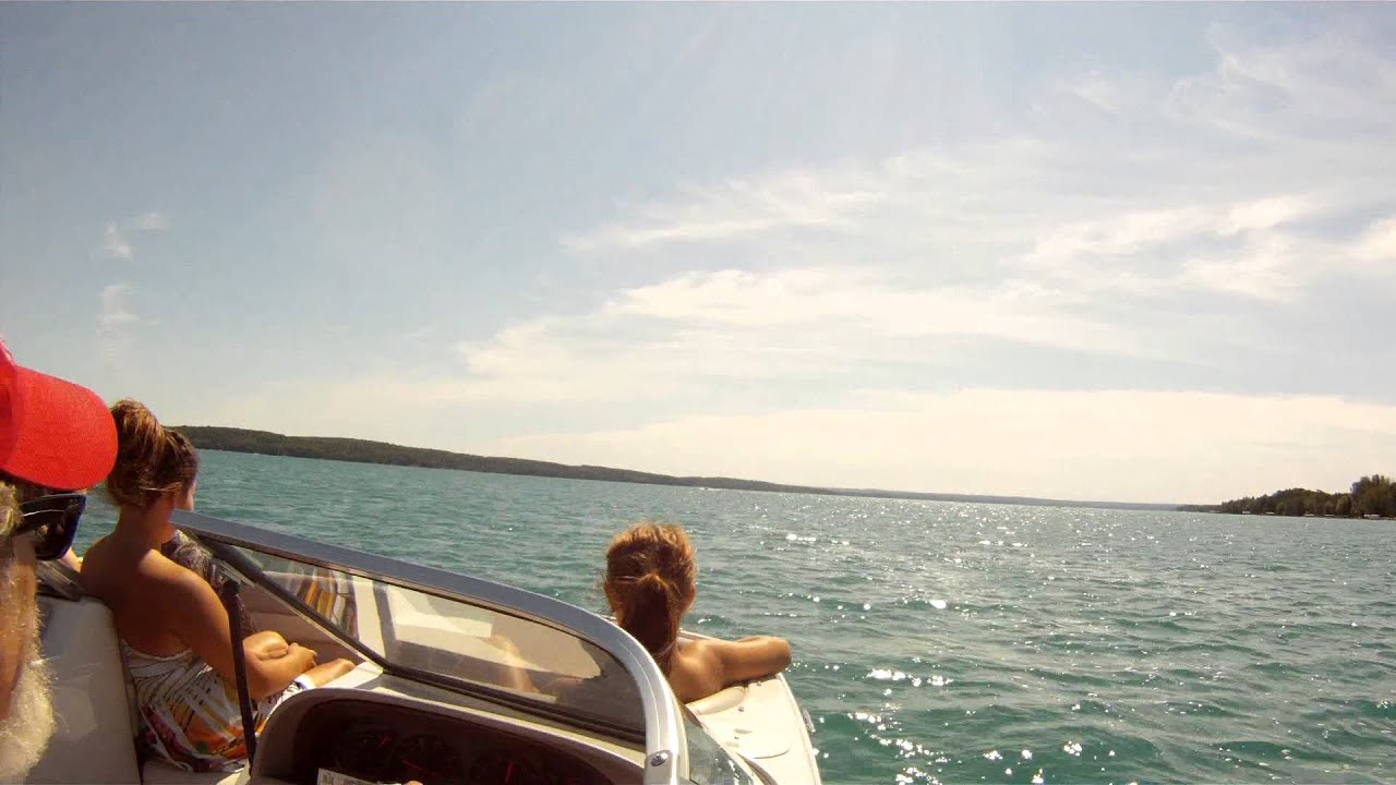 Riding in my friends boat on Elk Lake, Mi, on our way back to Torch ...