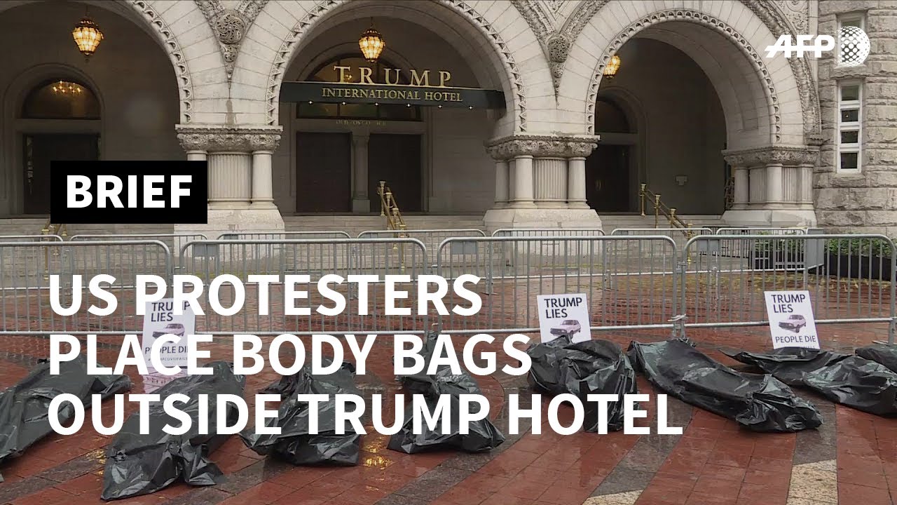 US protesters place body bags outside Trump hotel | AFP - YouTube