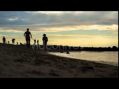 Footage - Boy and Girl Running With a Dog
