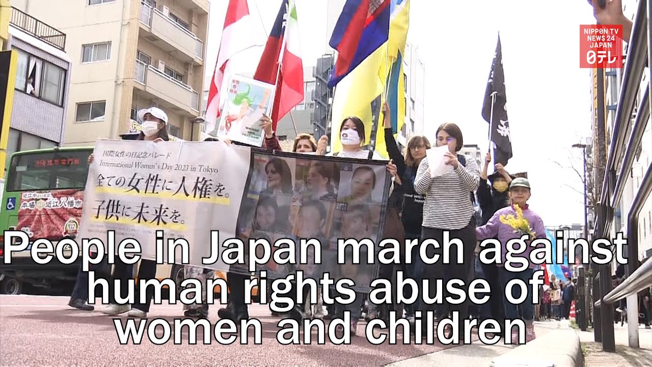 Foreign nationals in Japan march against human rights abuse of women ...