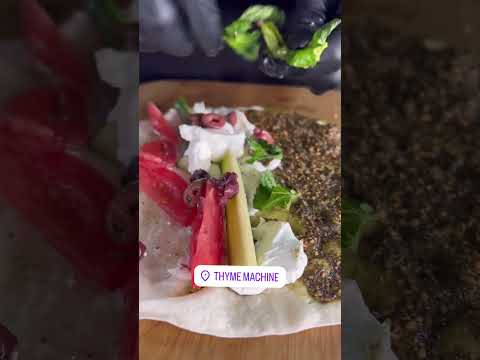 Imagine a whisper-thin circle of dough, kissed by flames under a sky far from home