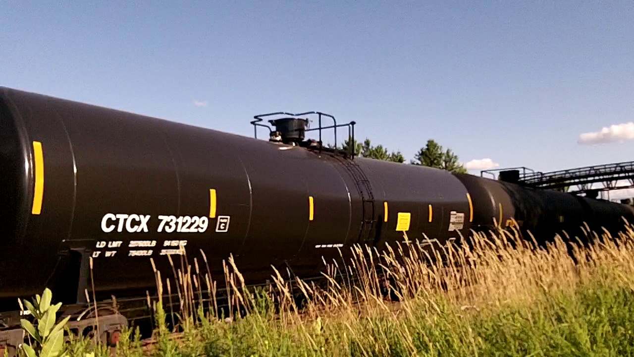 CN 394 w/ CN 3052 & CREX 1520 lead this long 572 axle, EB Mixed Freight ...