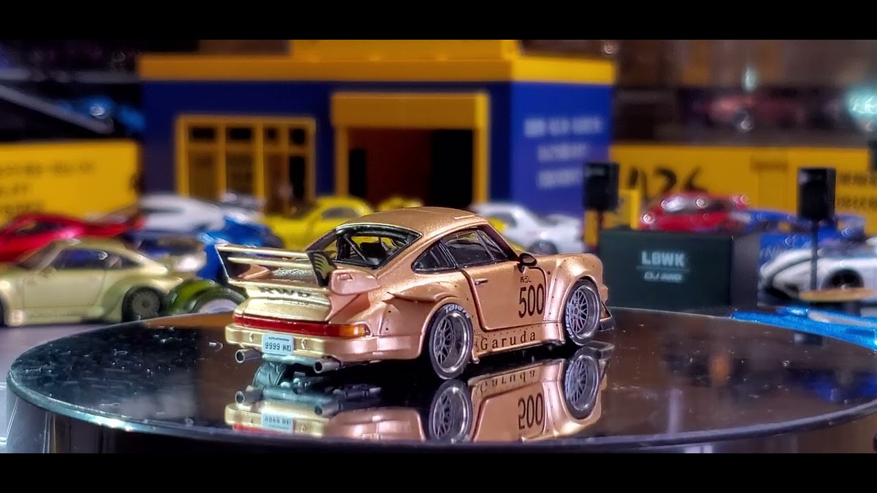 PGM 1/64 RWB 930 Garuda Gold - YouTube