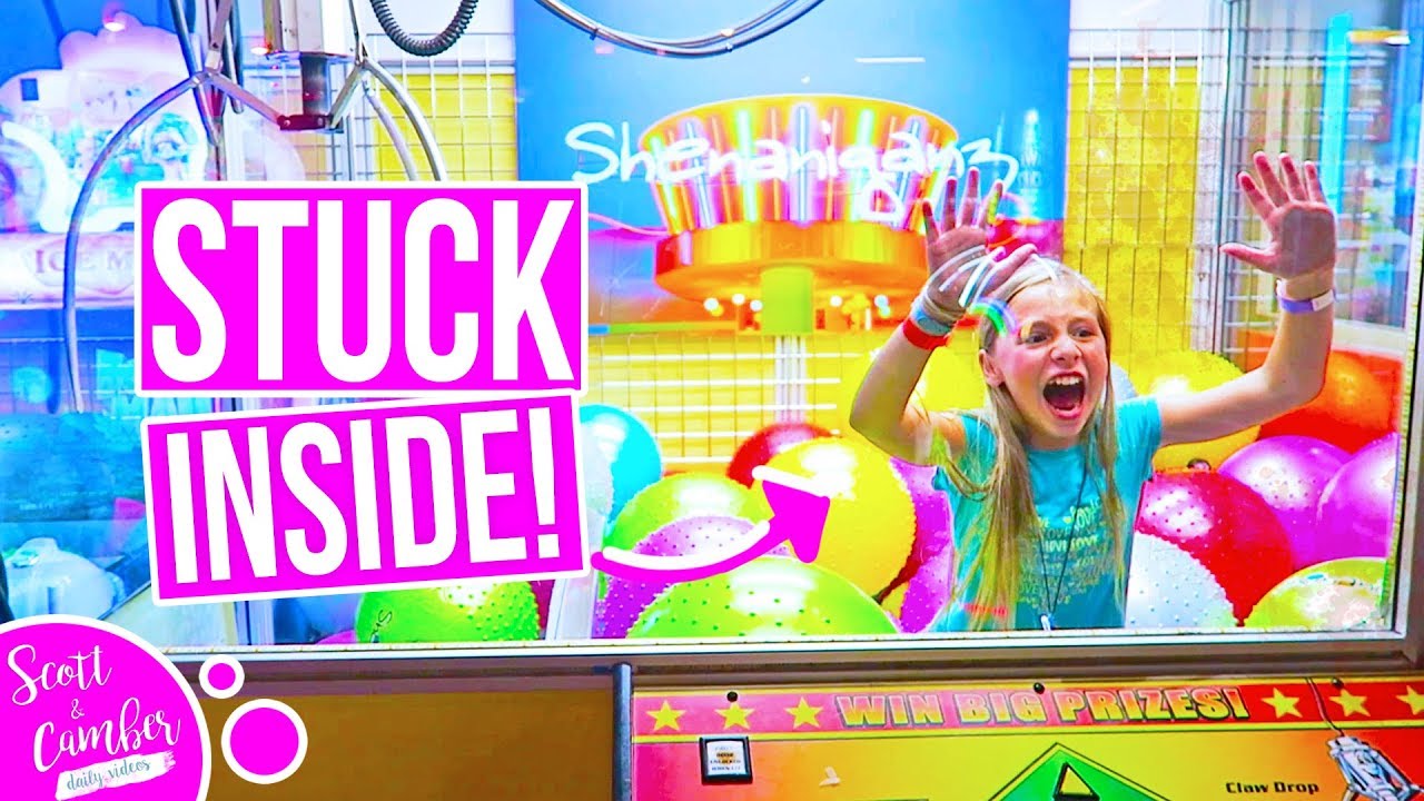 GIRL CLIMBS INSIDE A CLAW MACHINE AND GETS TRAPPED!! | SCOTT AND CAMBER ...