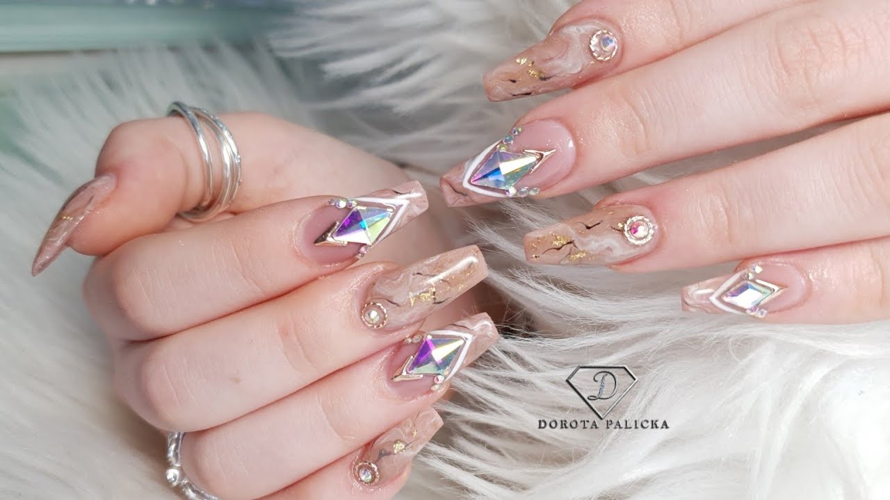 Gel nail extensions on tips with marble french and crystals placement ...