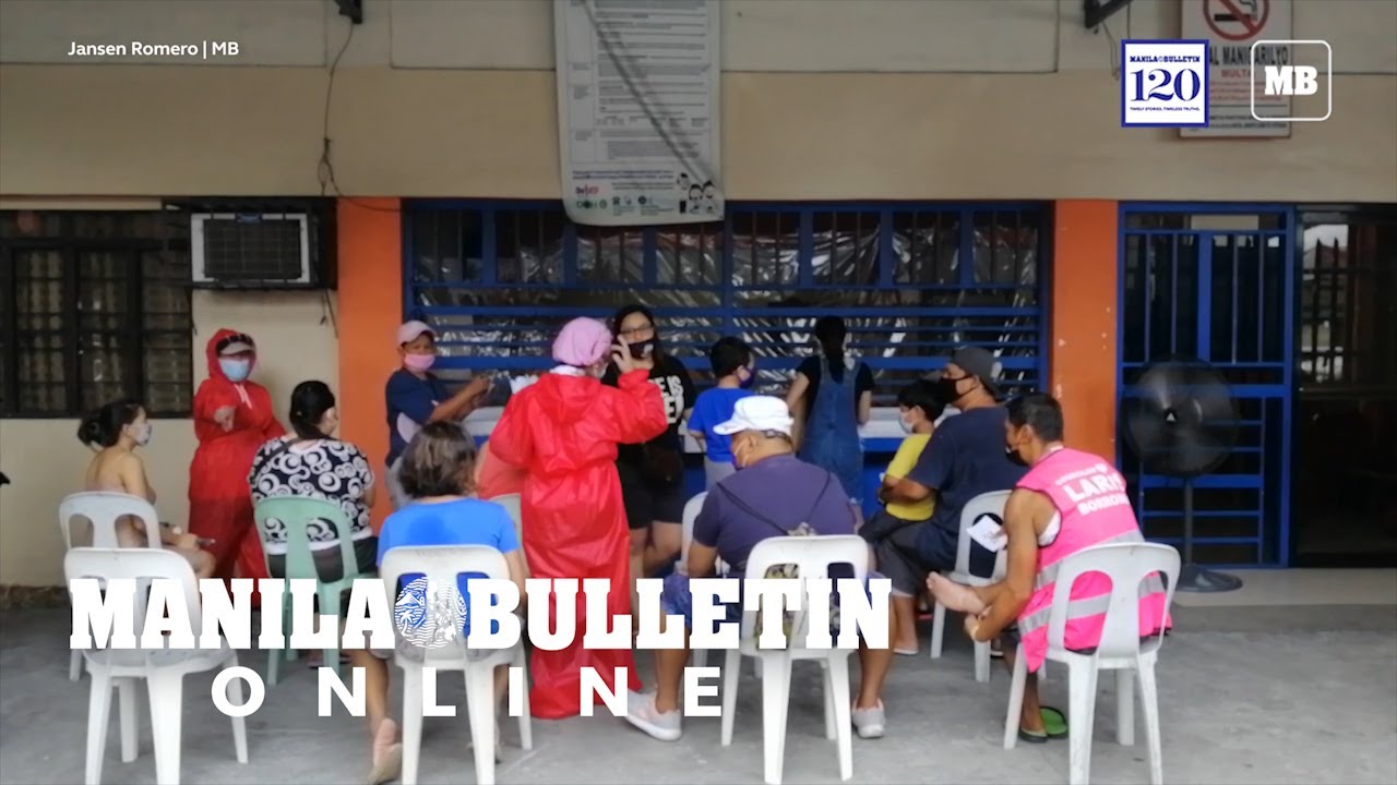 Frontliners and other residents of Paco Manila wait for their turn for ...