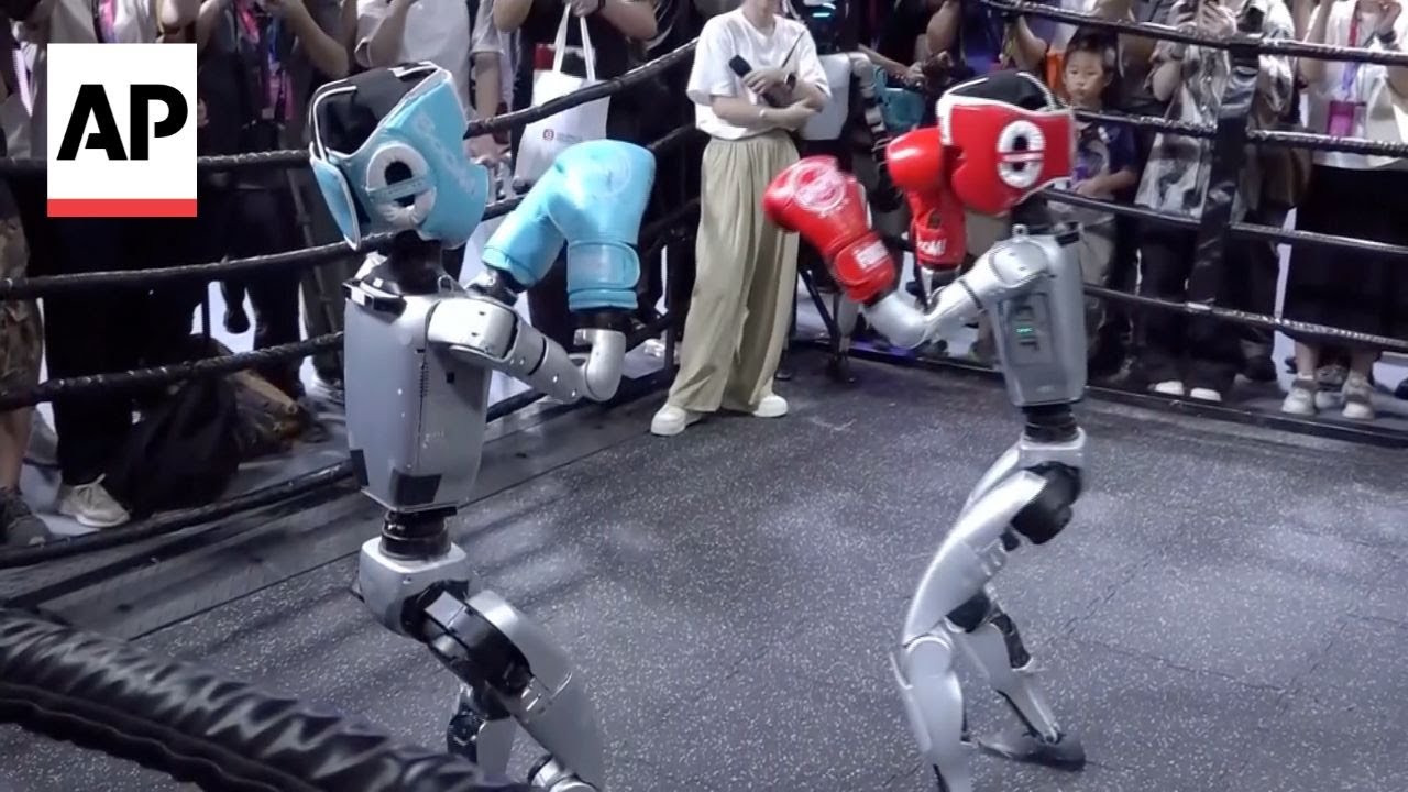 Robots fight in a boxing match at World Robot Conference in China - YouTube
