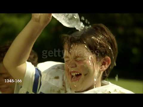 LITTLE BOY POURING A BOTTLE OF WATER ON HEAD