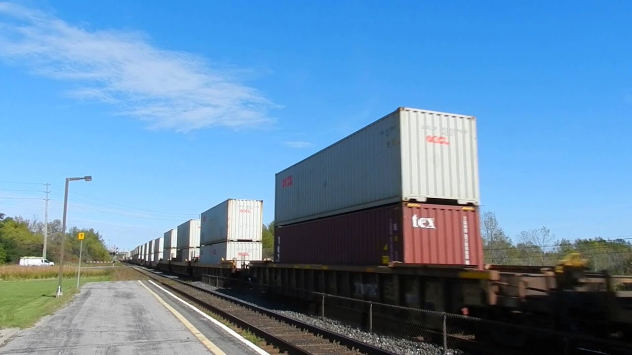 Westbound CN stack train passing Kingston VIA station (ET44AC 3008 in consist) - YouTube