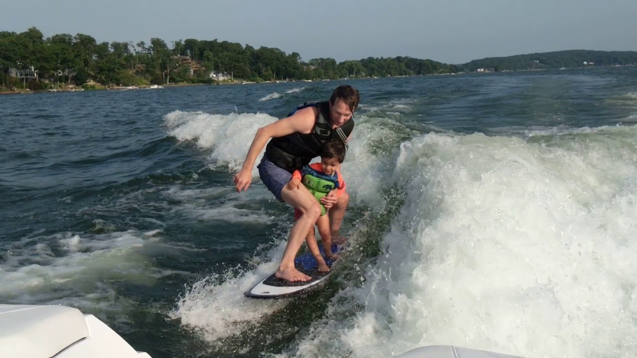 Leo with Brian wake surfing - YouTube