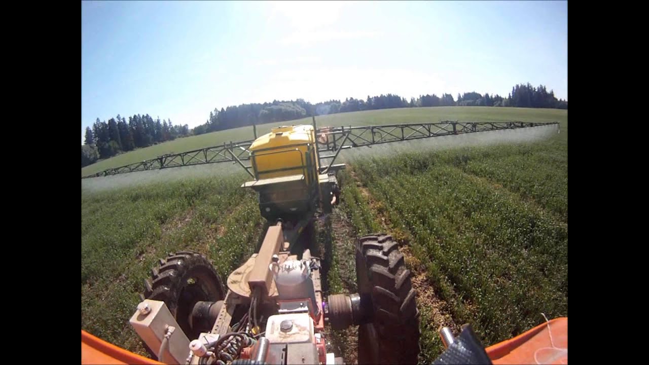 Spraying with the tructor. - YouTube