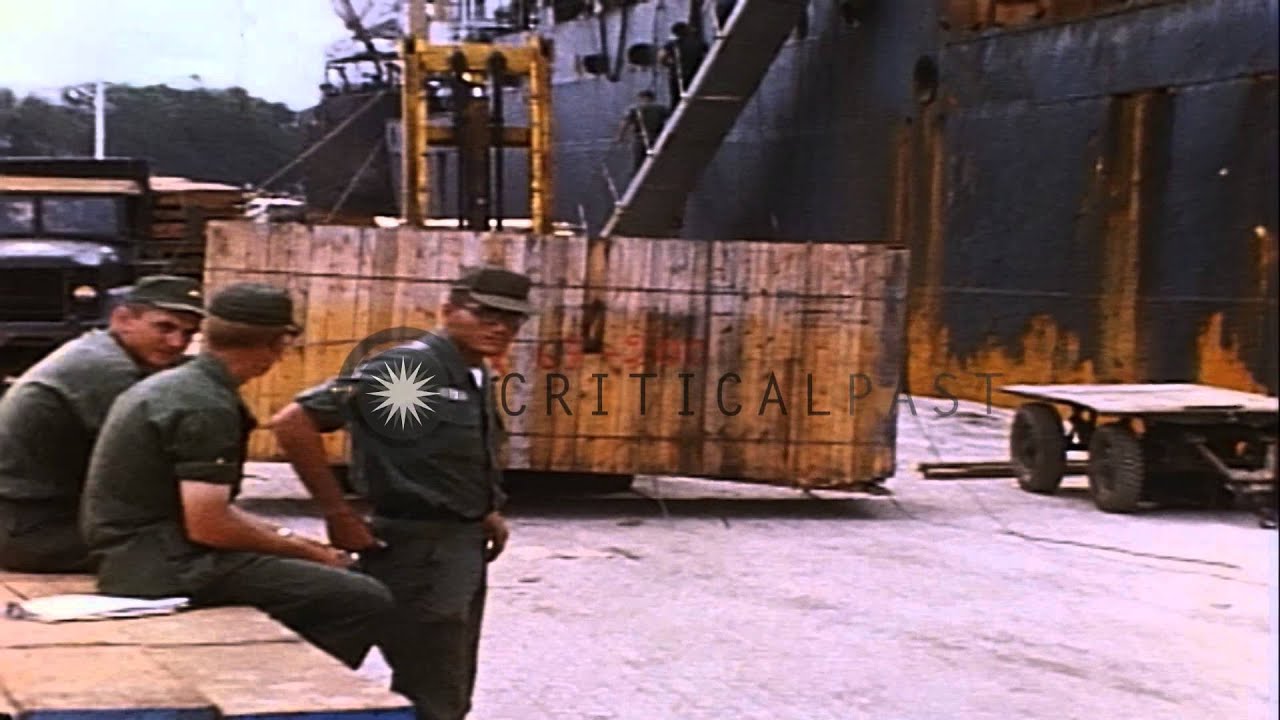United states soldiers and vietnamese unload a carrier vehicle from ...