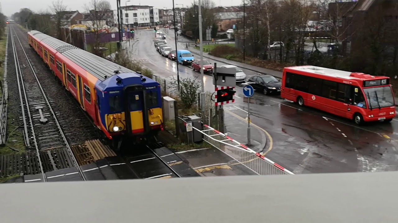 Raynes Park level crossing and Wimbledon tramway - YouTube