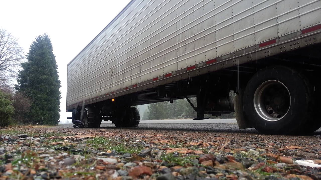 PUTTING CHAINS ON BIG RIG - YouTube