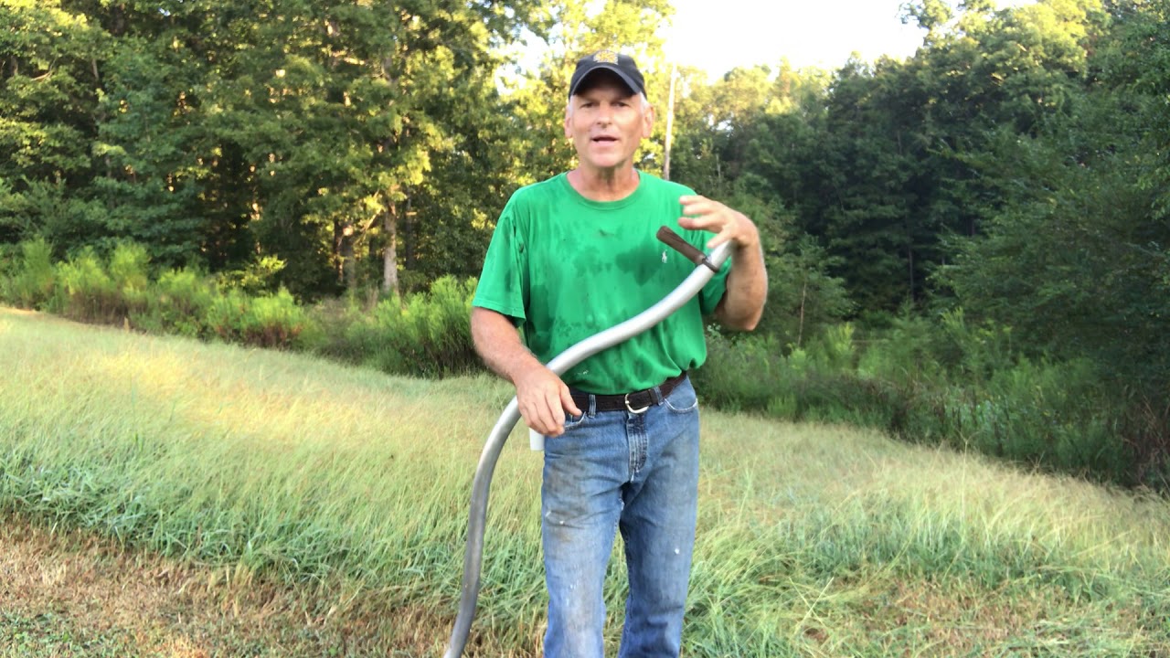 Hand cutting hay - YouTube