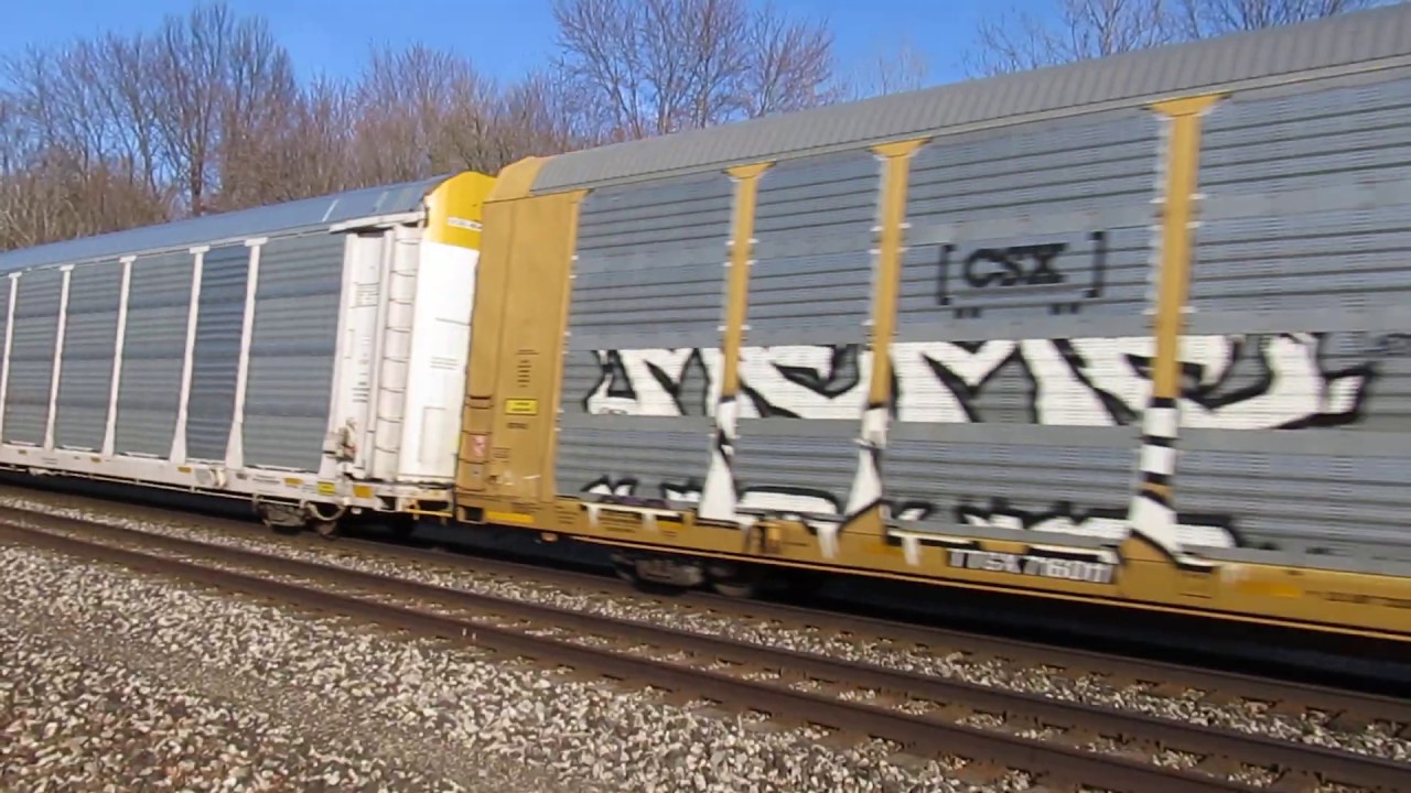 CN 2266, 2608 move an Eastbound mixed freight car, auto carrier freight ...