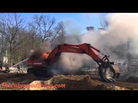 Excavator goes up in flames in Lakewood - YouTube