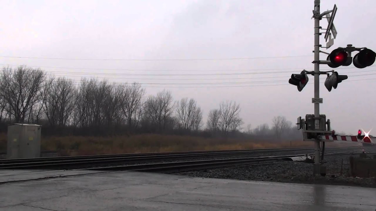 NS 2753 Leads Some Caterpillar Equipment East, Gary, IN - YouTube