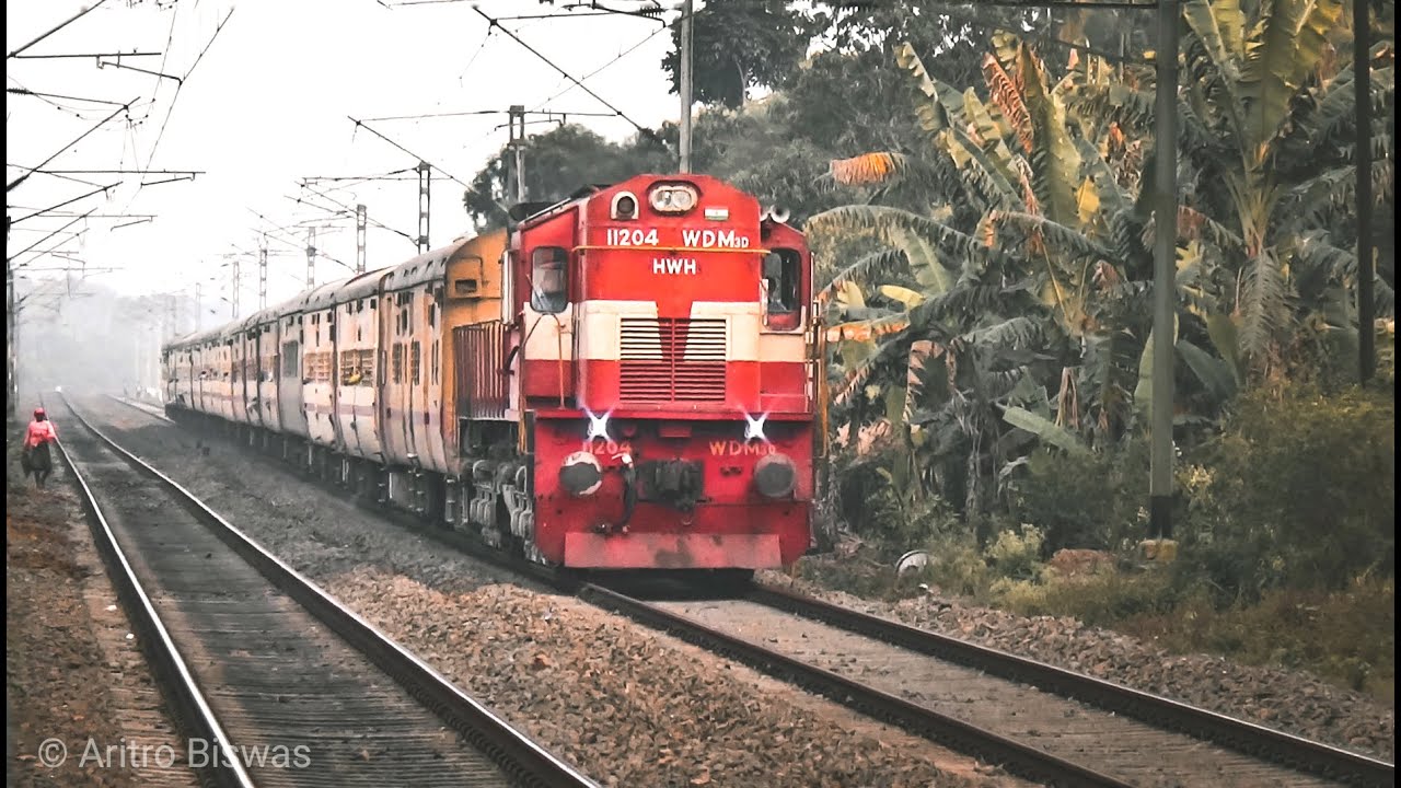 Diesel locomotive leading full UTKRISHT Intercity Express in a golden ...