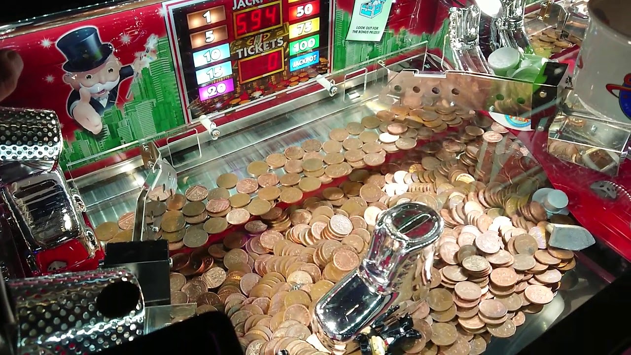 Playing The Monopoly 2p Coin Pusher In The Arcades - YouTube
