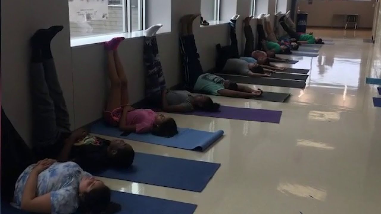 Local HS student helps fellow classmates by starting yoga club - YouTube
