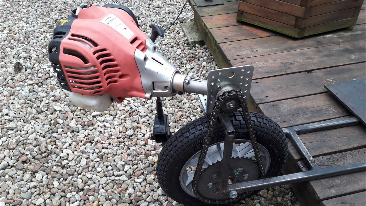 First tests of a scooter drive from a brush cutter motor - YouTube