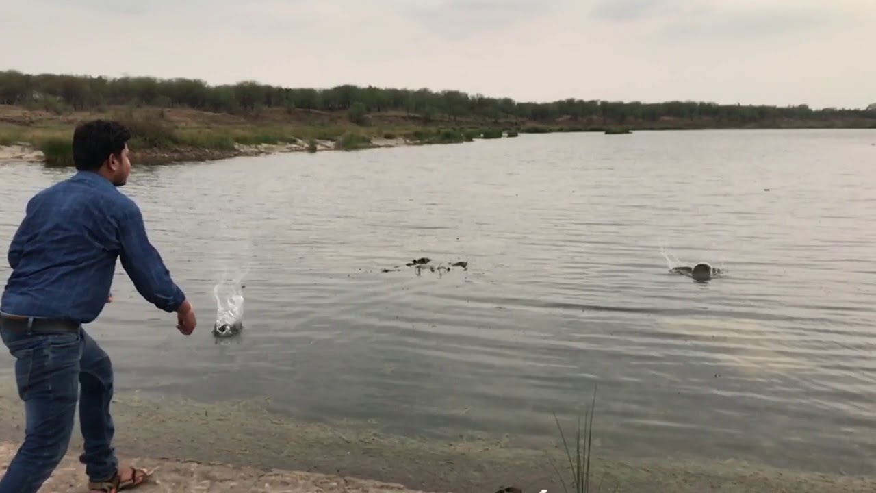 Throw stone in water - YouTube