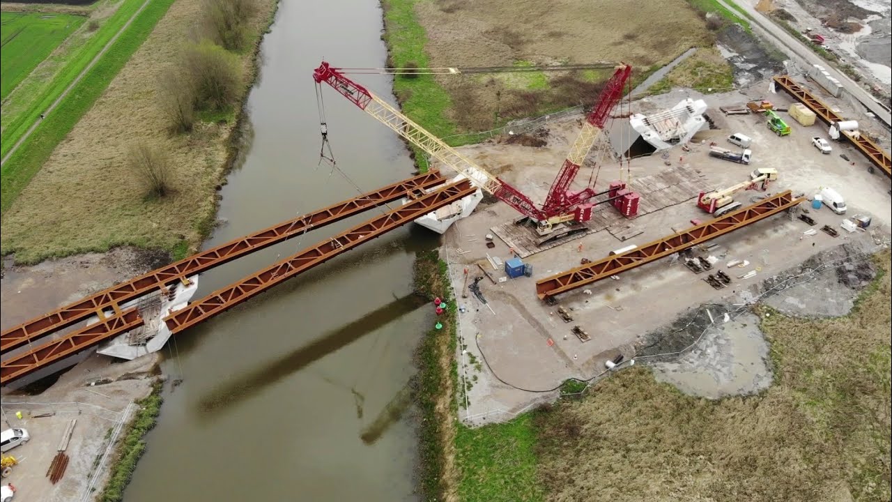Weldex 750t Crawler Crane Lifting Bridge span on Ely Southern Bypass ...